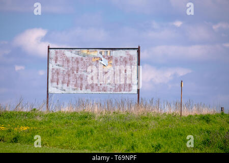 Torn billboard posters Stock Photo - Alamy