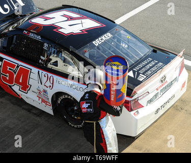 The crew for Natalie Decker works on her car during the NASCAR Truck ...