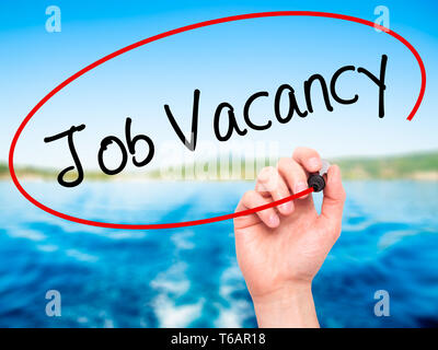 Man Hand writing Job Vacancy with black marker on visual screen ...