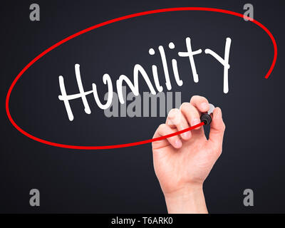Man Hand writing Humility with black marker on visual screen. Isolated ...