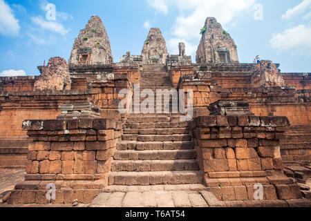 Three towers and long stairs of ancient temple in Angkor. Cambodia ...