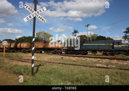 Cuba, railroadcrossing with train Stock Photo - Alamy