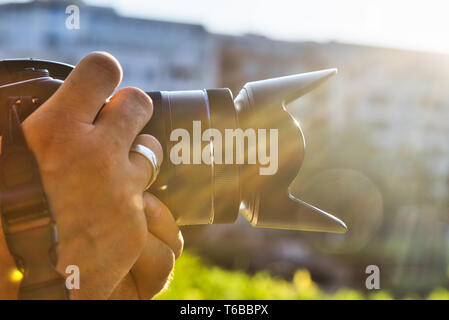 close up of photographers hands with camera Stock Photo - Alamy