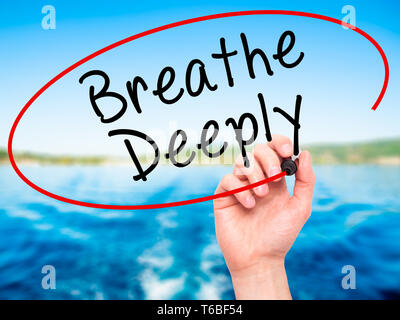 Man Hand writing Breathe Deeply with black marker on visual screen ...