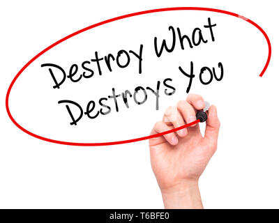 Man Hand writing Destroy What Destroys You with black marker on visual ...