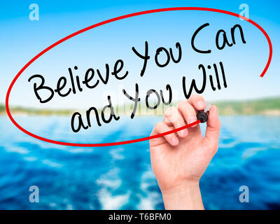 Man Hand writing What Motivates You? with black marker on visual screen ...