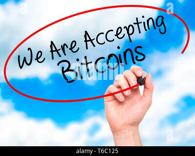 We are accepting bitcoins , Man Writing on Glass Stock Photo - Alamy