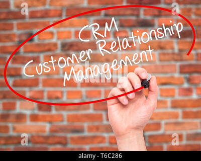 Man Hand writing CRM Customer Relationship Management with black marker ...
