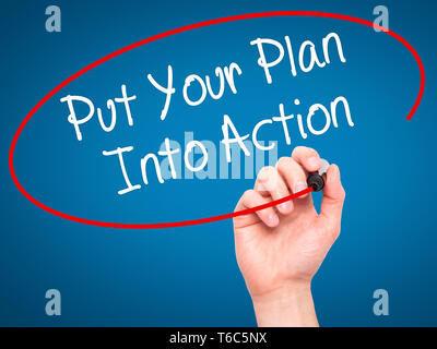 Man Hand writing Put Your Plan Into Action with black marker on visual ...