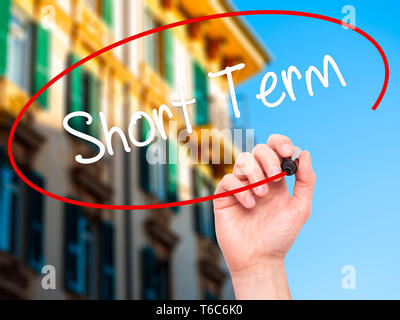 Man Hand writing Short Term with black marker on visual screen ...
