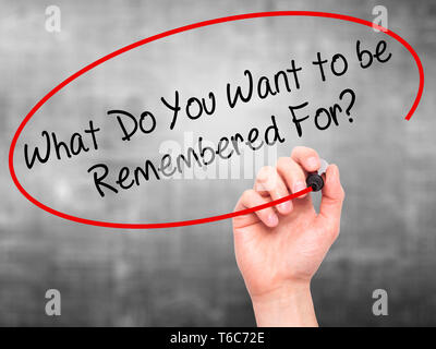 Man Hand writing What Do You Want to be Remembered For? with black ...