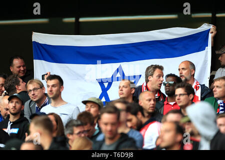 Ajax fans hold a Israel flag in the stands during the Champions League ...