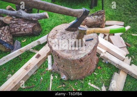 two axes on block Stock Photo - Alamy