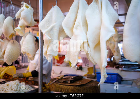 Beef tripe, the stomach lining of a cow, lies in a pile on sale at a ...