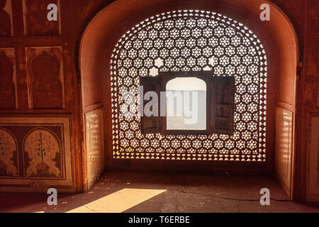 Indian fort window carved in sandstone with flower motif and geometric ...