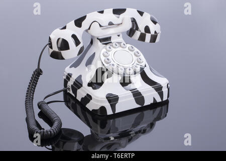 Set of vintage objects with a telephone in the foreground, a record ...