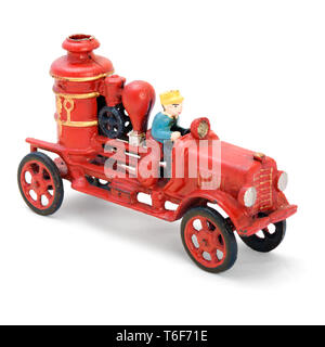 Antique wind up car toy with family inside isolated on a white ...