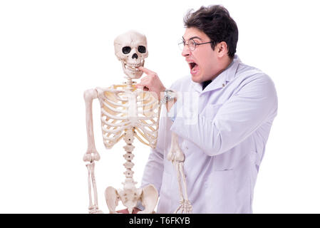 Young doctor with skeleton isolated on white Stock Photo - Alamy