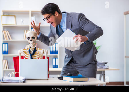 The angry boss yelling at his skeleton employee Stock Photo - Alamy