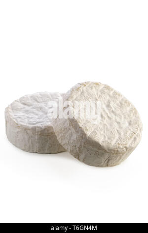 Whole round Camembert cheese cut in half showing ripe runny interior ...
