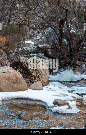 Half frozen river with melting ice Stock Photo - Alamy