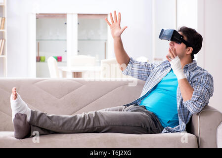 The man with hand injury wearing virtual reality glasses Stock Photo ...