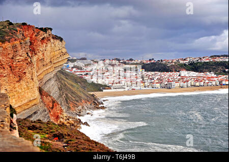 Panorama of Nazare town with dramatic sky on stormy day, Portugal Stock ...