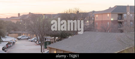 Panoramic view typical apartment complex with detached garage, covered ...