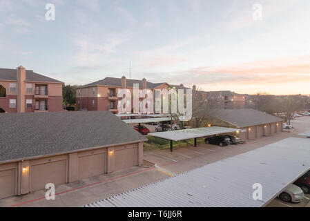 Typical apartment complex with detached garage and covered parking lots ...
