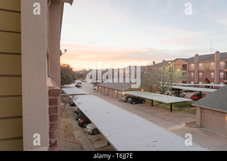 Typical apartment complex with detached garage and covered parking lots ...