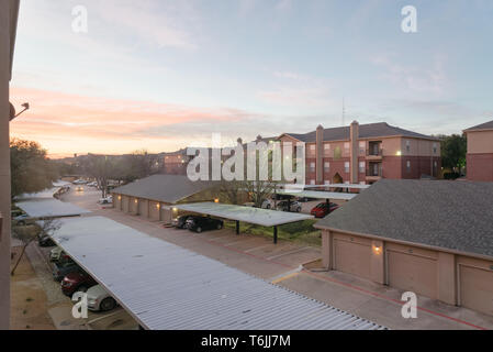 Typical apartment complex with detached garage and covered parking lots ...