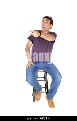 laughing man pointing with finger while watching comedy near woman ...