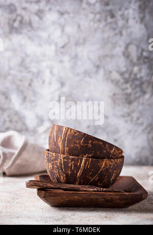Empty bowls made of wood of brown color Stock Photo - Alamy