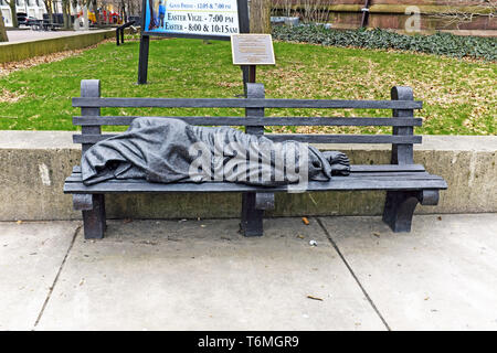 Life-sized Homeless Jesus statue lying on a park bench is a sculpture ...