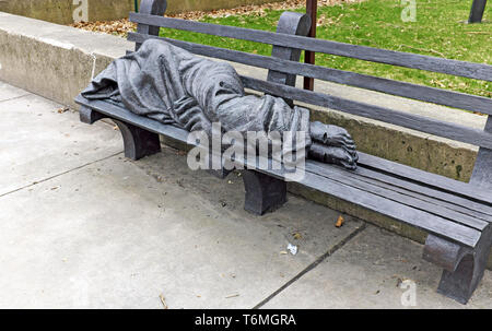 Homeless Jesus sculpture bronze on a bench outside Christ Church ...