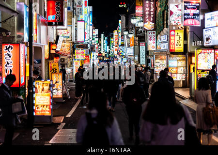 Shinjuku, Japan - April 3, 2019: People walking on famous red light ...