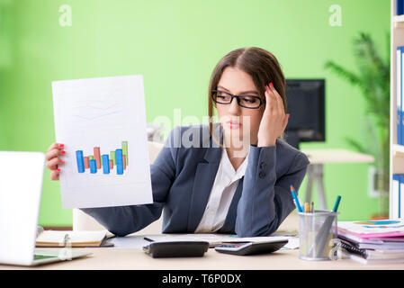 Female financial manager presenting graph chart sitting in the o Stock ...