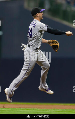 Colorado Rockies third baseman Ryan McMahon (24) throwing during ...