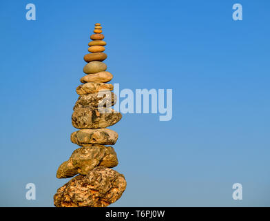 21 April 2019, Denmark, Klitmöller: Surfers are waiting for a wave in ...