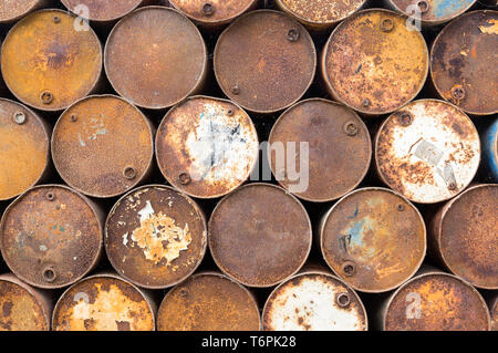 A stack of old rusty oil drums in a farmers field Stock Photo - Alamy