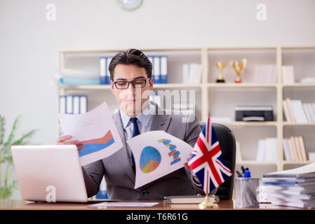 Businessman with British flag in the office Stock Photo - Alamy
