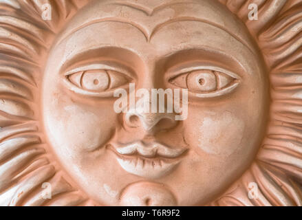 Terracotta sun face Stock Photo - Alamy
