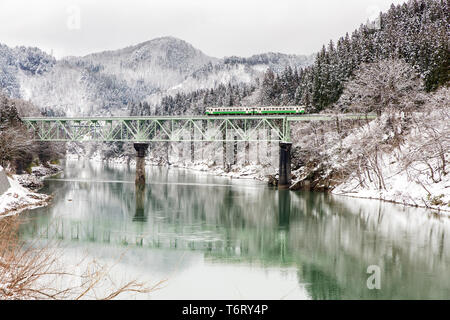 Train in Winter landscape snow on bridge Stock Photo - Alamy