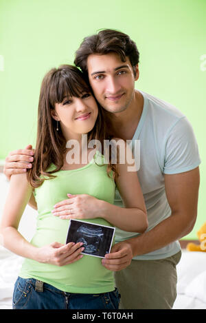 Young family finding out about pregnancy Stock Photo - Alamy