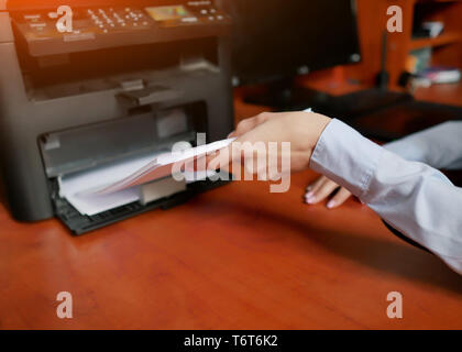 Human hand is reloading the paper to printer tray Stock Photo - Alamy