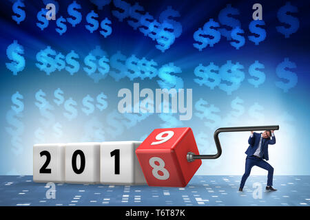 Businessman employee rotating cube to reveal number 2019 Stock Photo ...