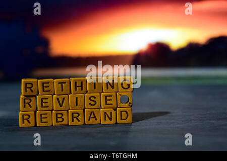 Rethink, revise, rebrand symbol. Wooden blocks with words 'rethink, revise, rebrand'. Beautiful ...