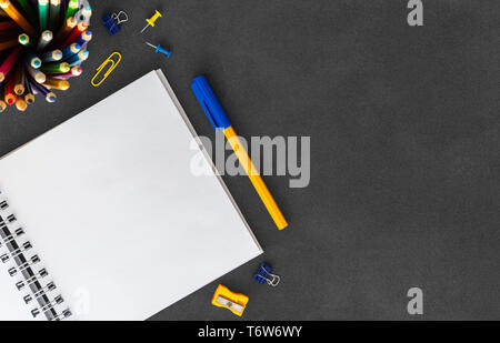 Open notebook, pen and pins on pink background Stock Photo - Alamy