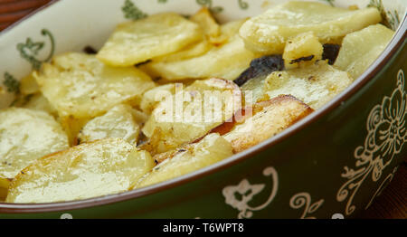 English Lancashire hot pot with meat and potato closeup in the baking ...