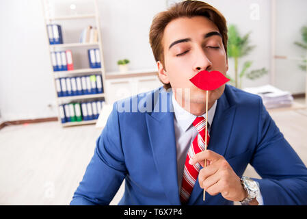 Funny bisinessman with fake lips in the office Stock Photo - Alamy